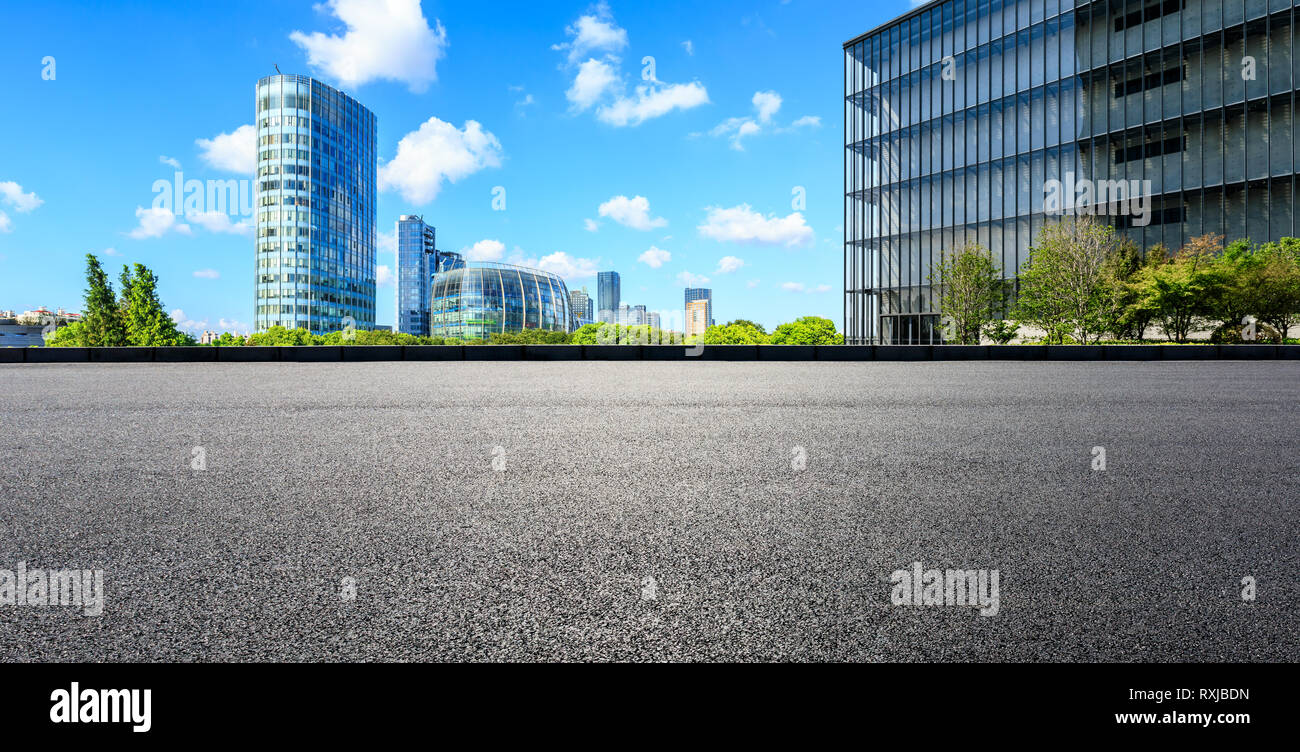 Empty asphalt road and modern commercial buildings in Shanghai Stock ...