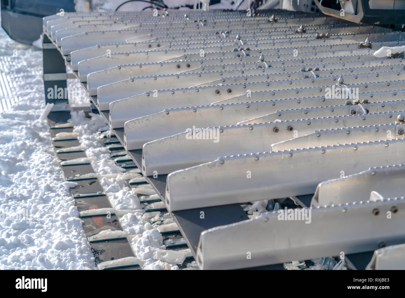 Continuous track of a snow groomer in Park City Stock Photo - Alamy