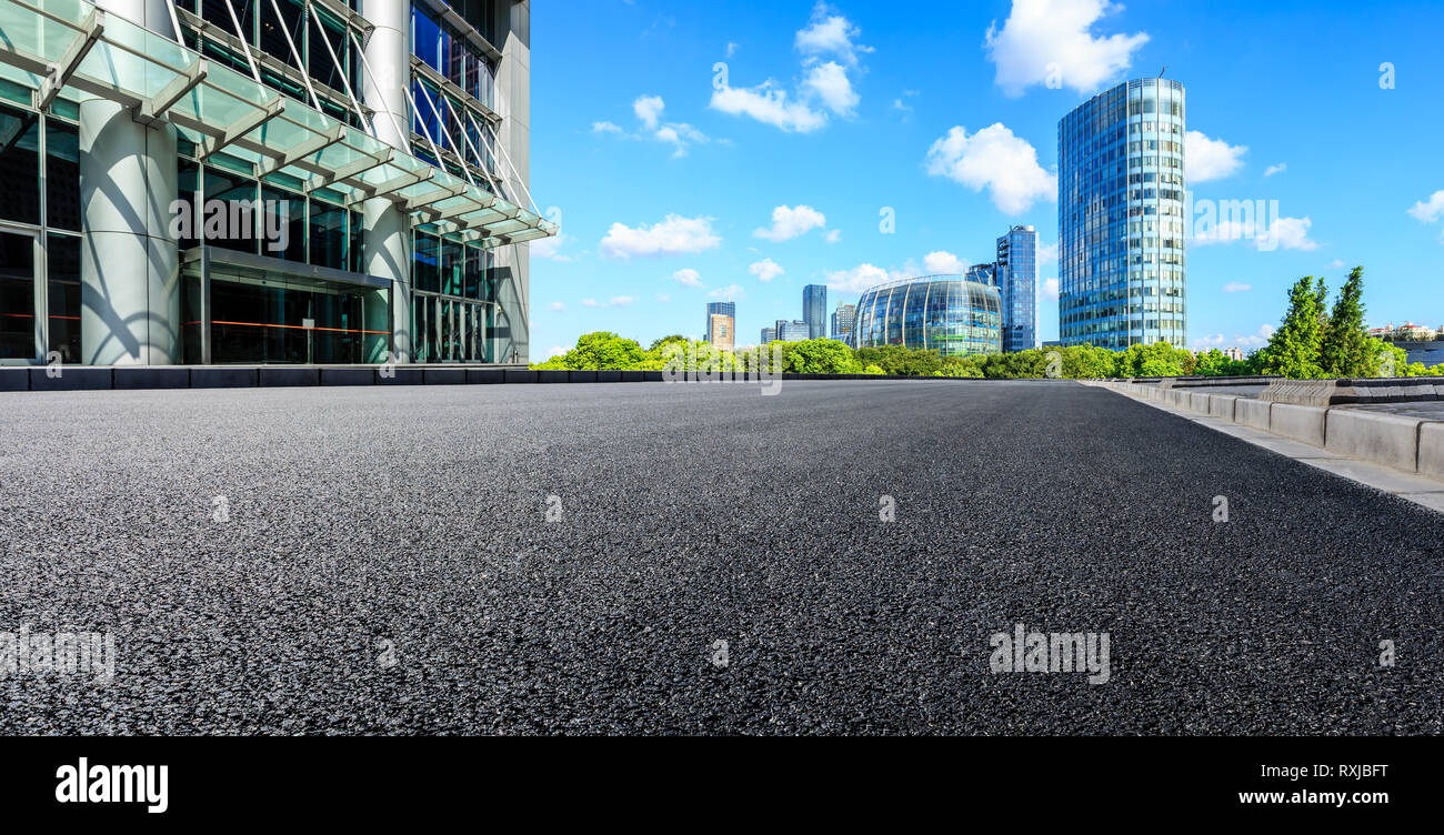 Empty asphalt road and modern commercial buildings in Shanghai Stock ...