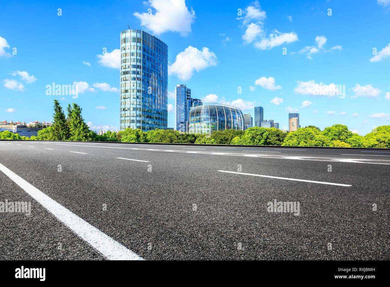 Empty asphalt road and modern commercial buildings in Shanghai Stock ...