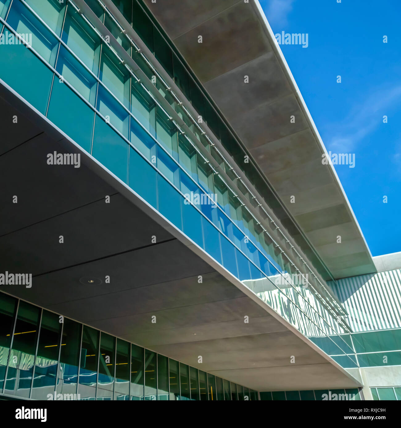 Modern building exterior with shiny glass windows Stock Photo - Alamy