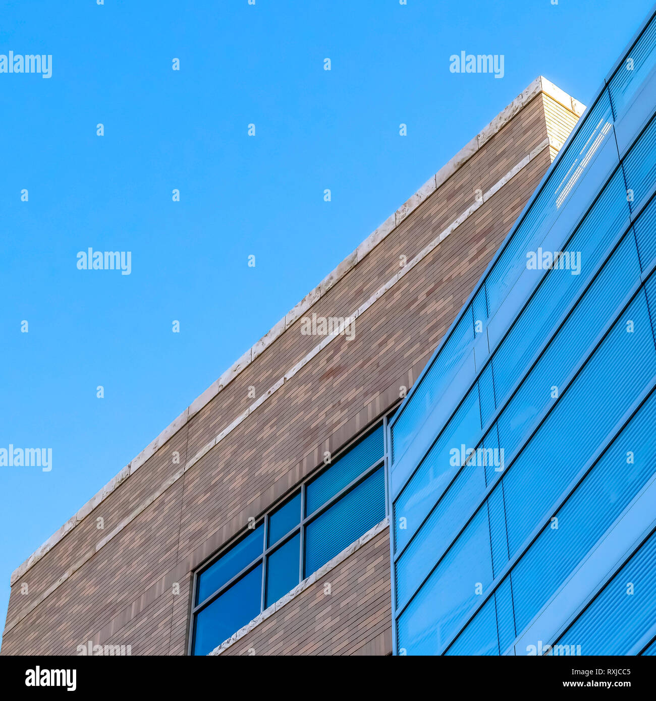 Modern building with vibrant blue sky overhead Stock Photo - Alamy