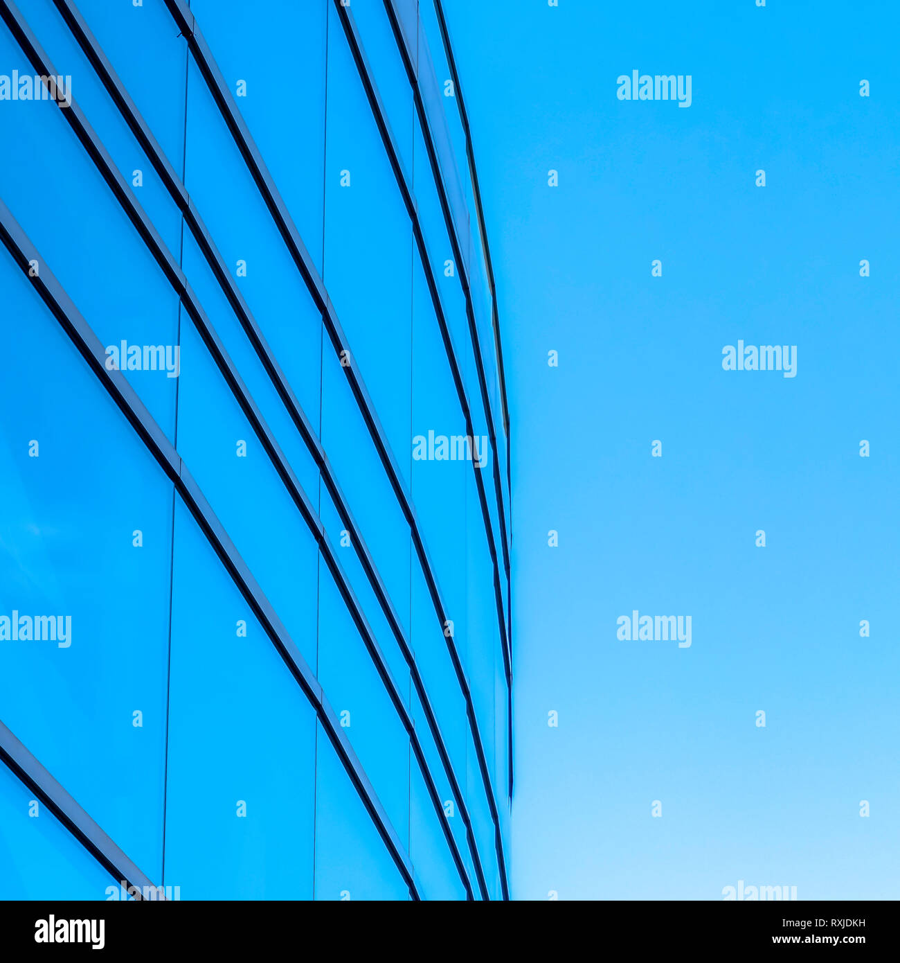 Reflective glass windows of building against sky Stock Photo - Alamy