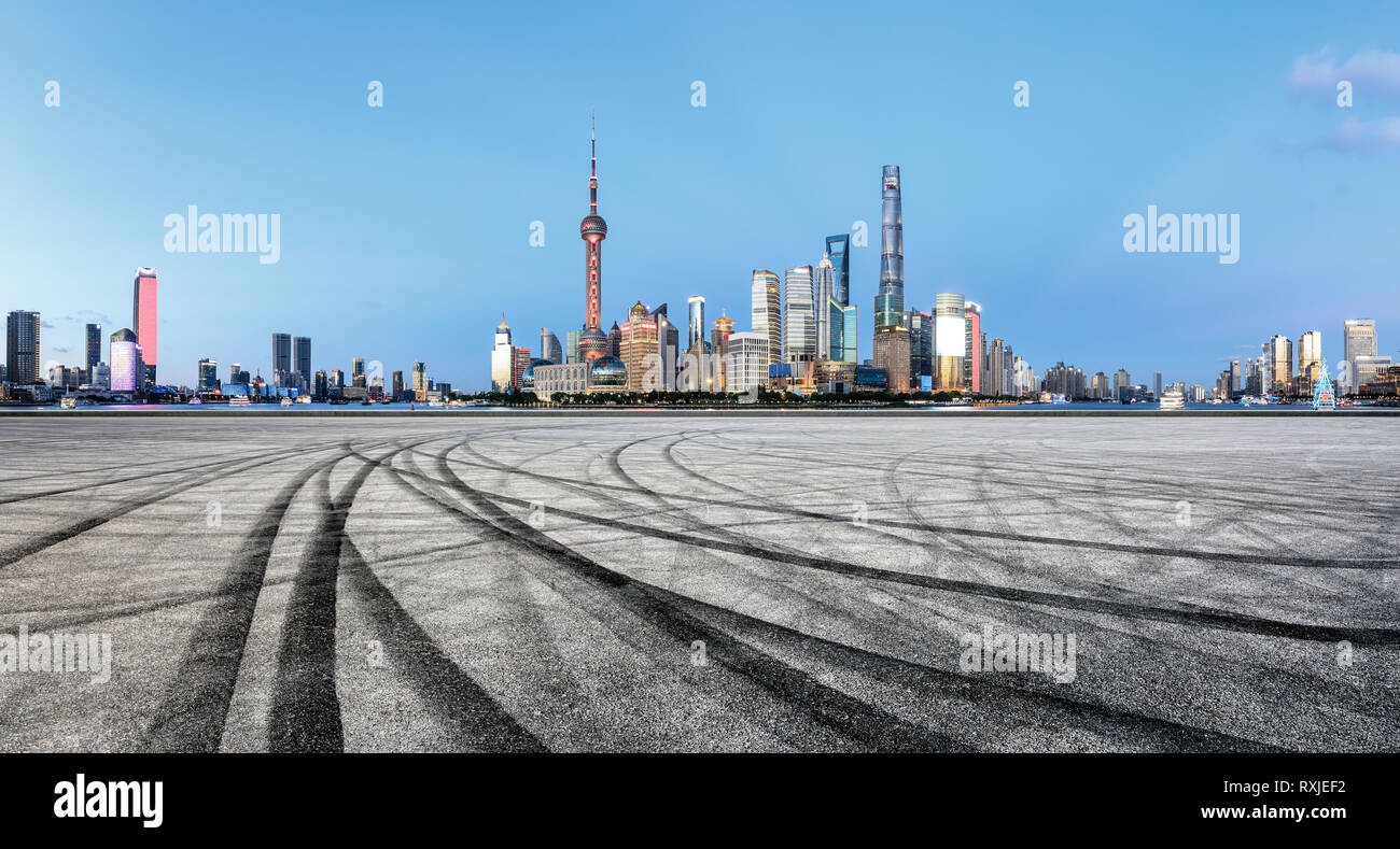 Empty asphalt square ground with panoramic city skyline in Shanghai ...