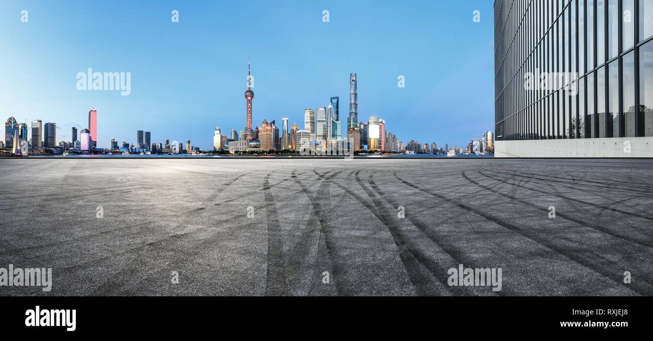 Empty asphalt square ground with panoramic city skyline in Shanghai ...
