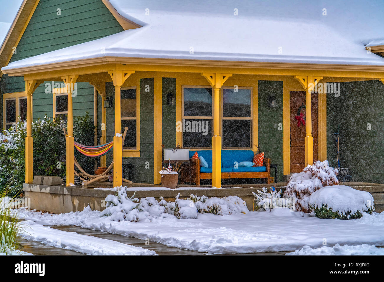 Snow falling on a beautiful home in Daybreak Utah Stock Photo - Alamy