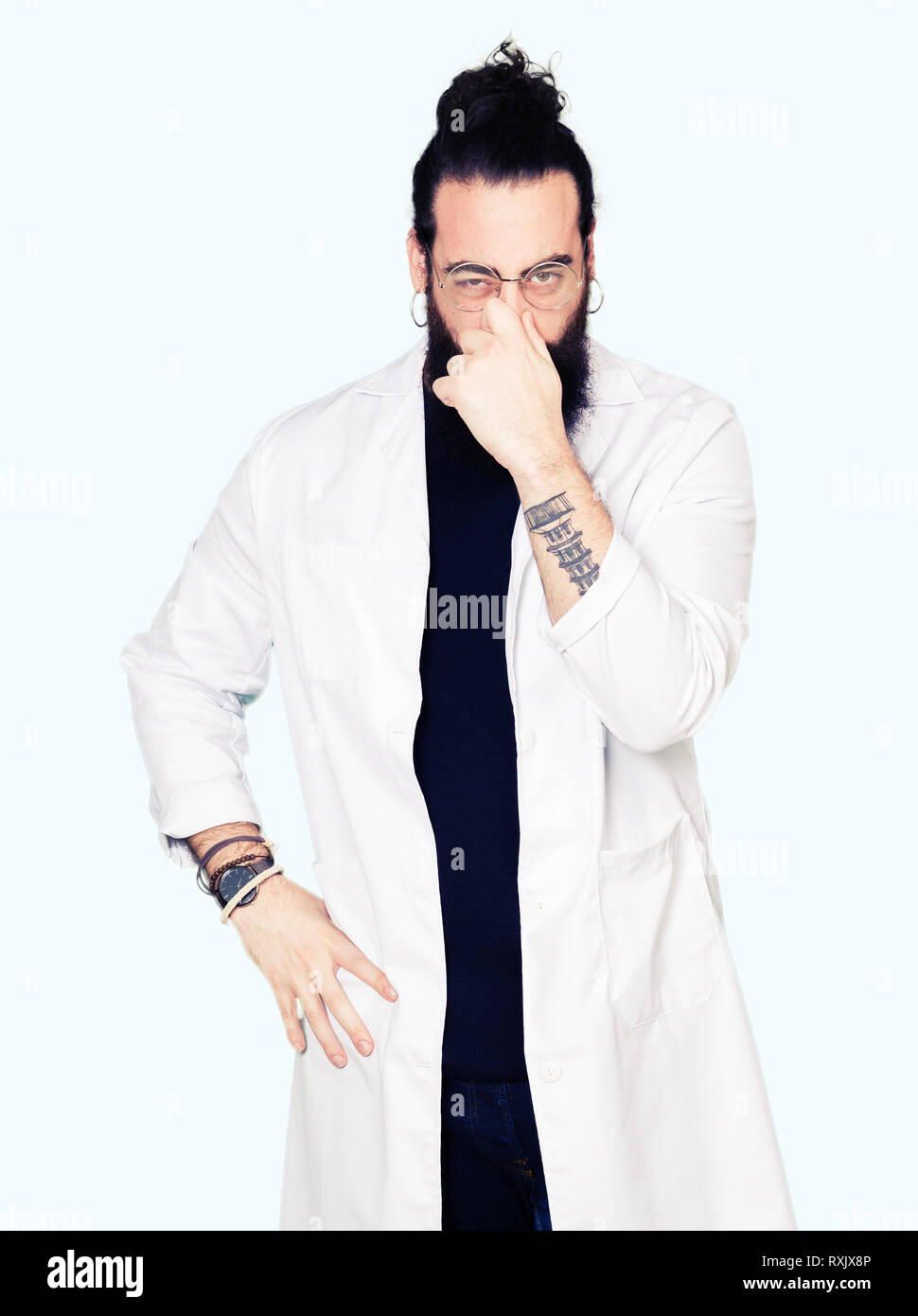 Doctor therapist man with long hair and bear wearing white coat ...