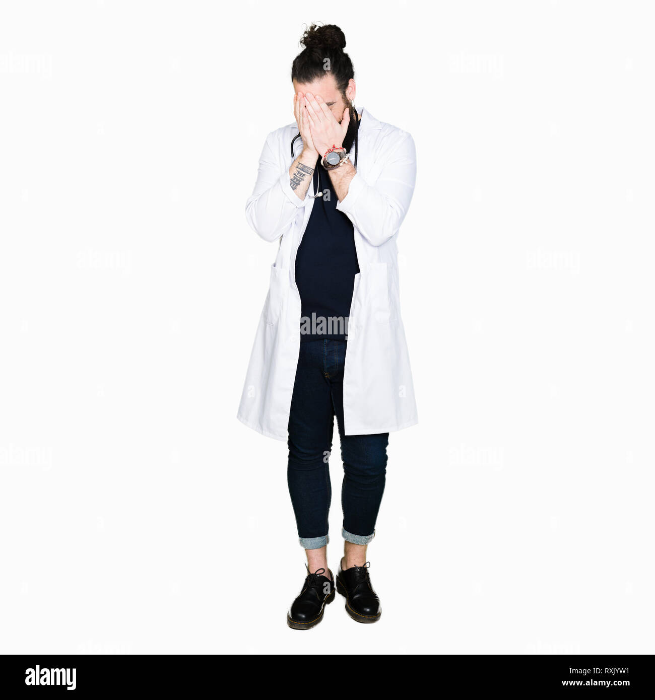 Doctor with long hair wearing medical coat and stethoscope with sad ...