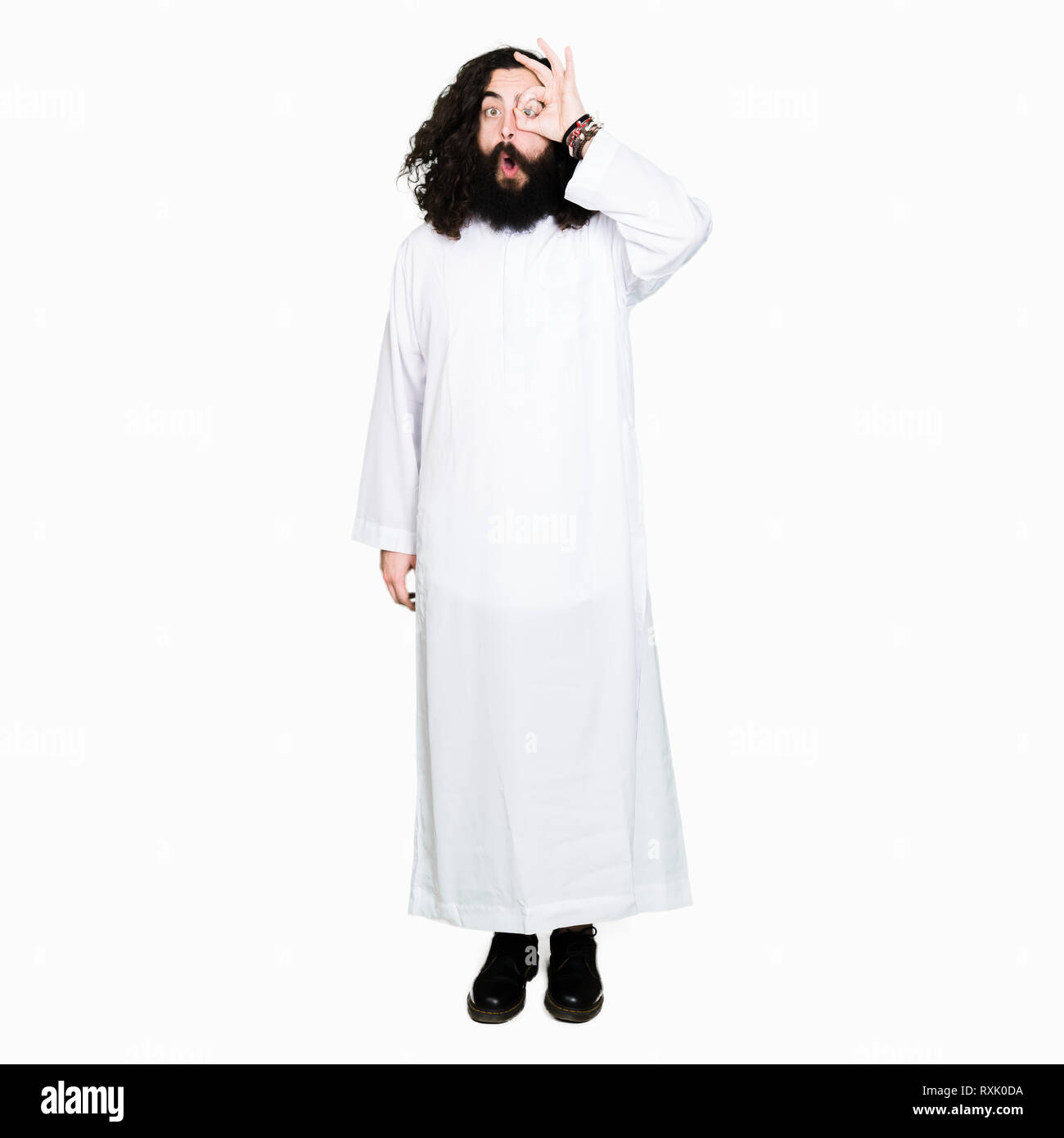 Man wearing Jesus Christ costume doing ok gesture shocked with ...