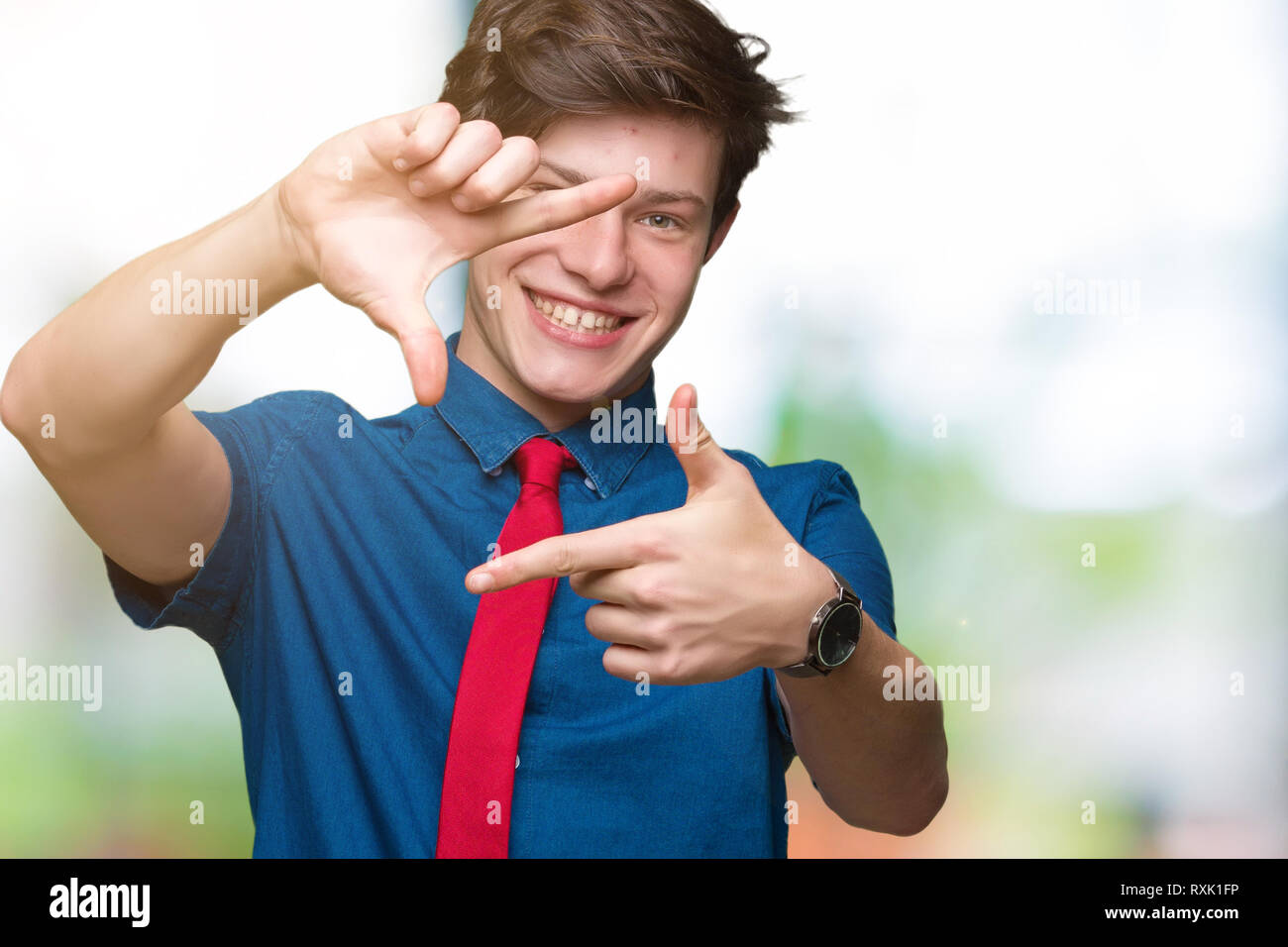 Young handsome business man wearing red tie over isolated background ...