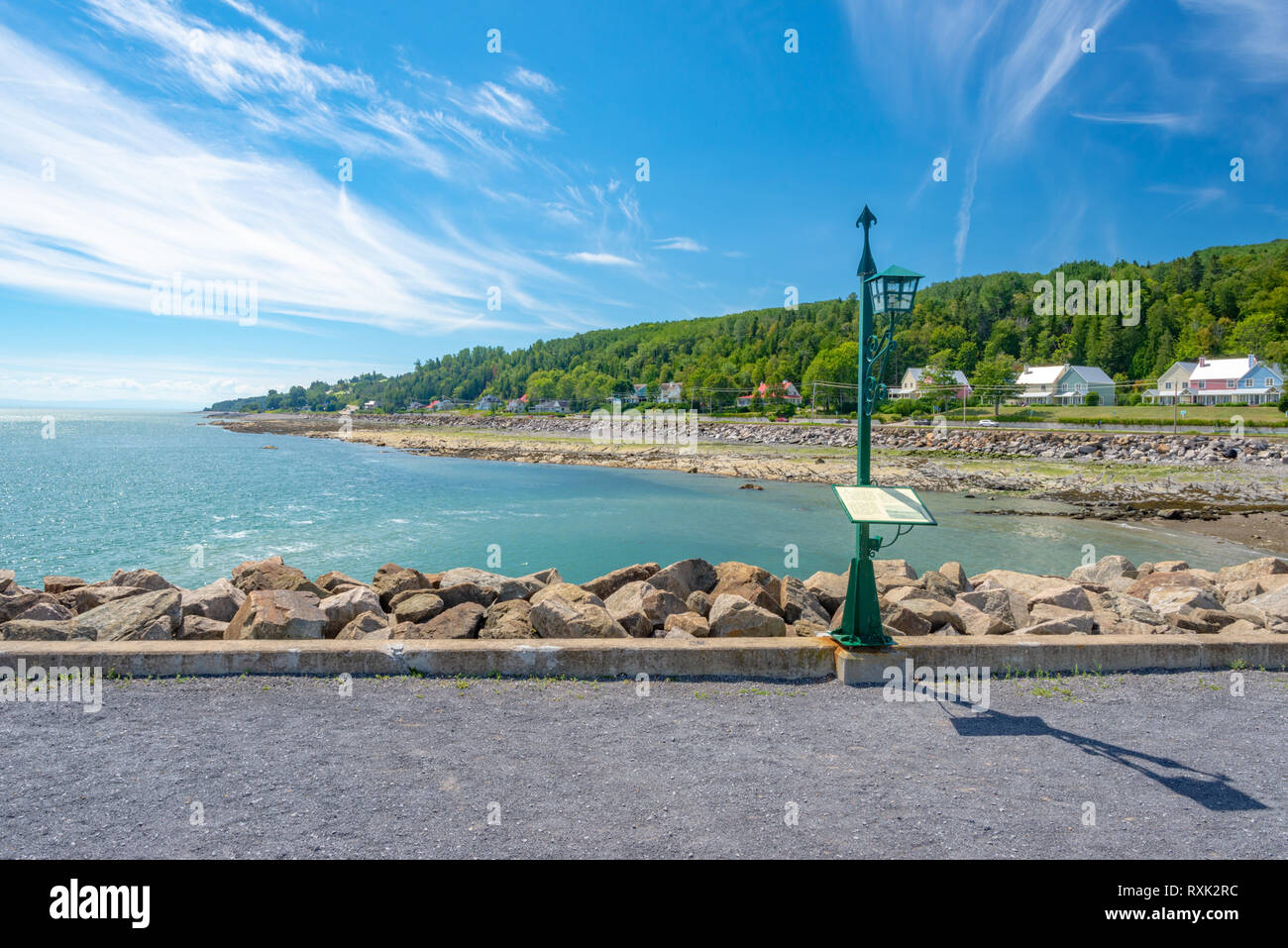 Light post on a quay on the St.Lawrence River in St.Irenee, province of ...