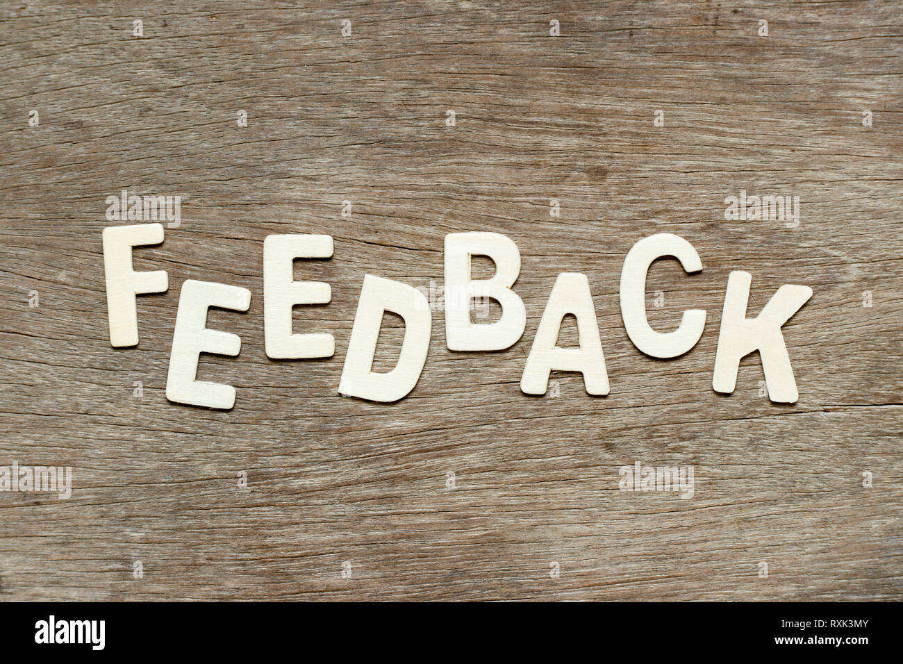 Alphabet letter in word feedback on wood background Stock Photo - Alamy
