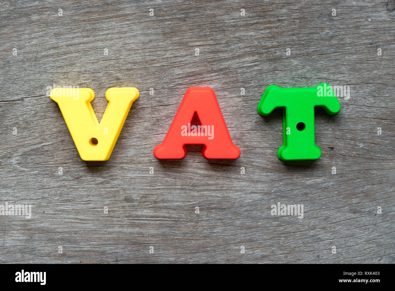 Colorful plastic alphabet in word VAT (Abbreviation of value added tax ...