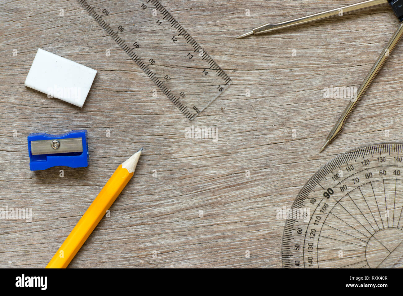 Education or draft tool on wood background (pencil, sharpener, set ...