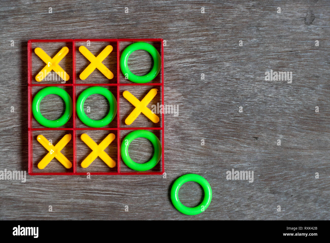 Tic tac toe game on wood background (Concept think outside the box ...