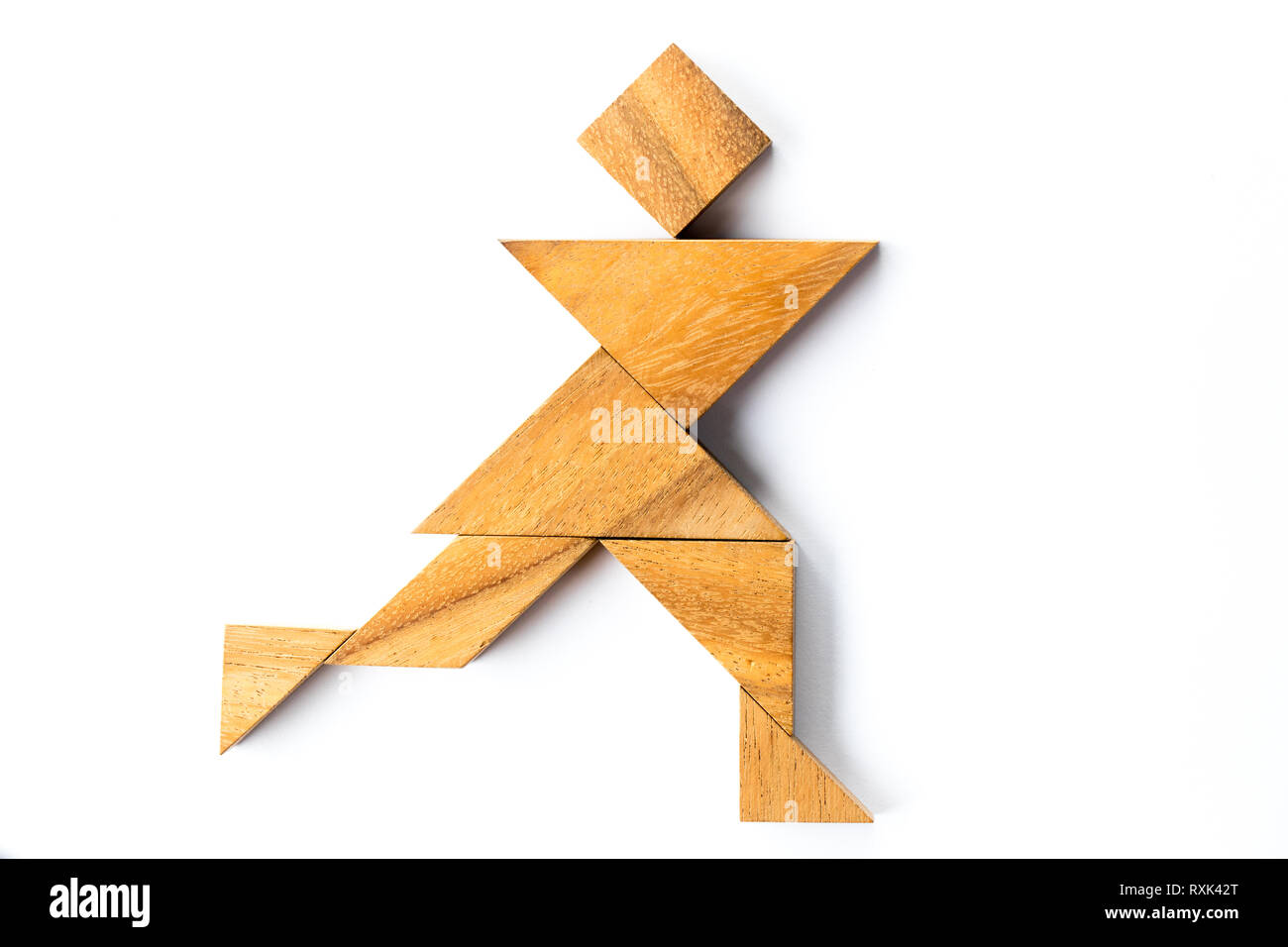 Wood tangram puzzle in man running shape on white background Stock ...