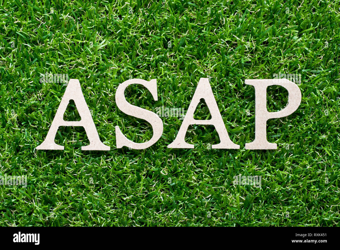 Wood alphabet in word ASAP (Abbreviation of as soon as possible) on ...