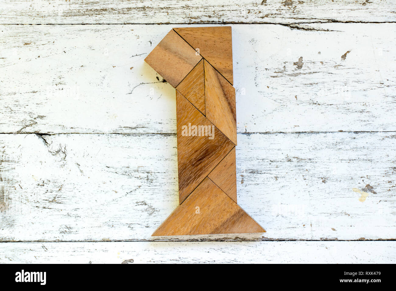 Tangram puzzle in number one shape on old white wood background Stock ...