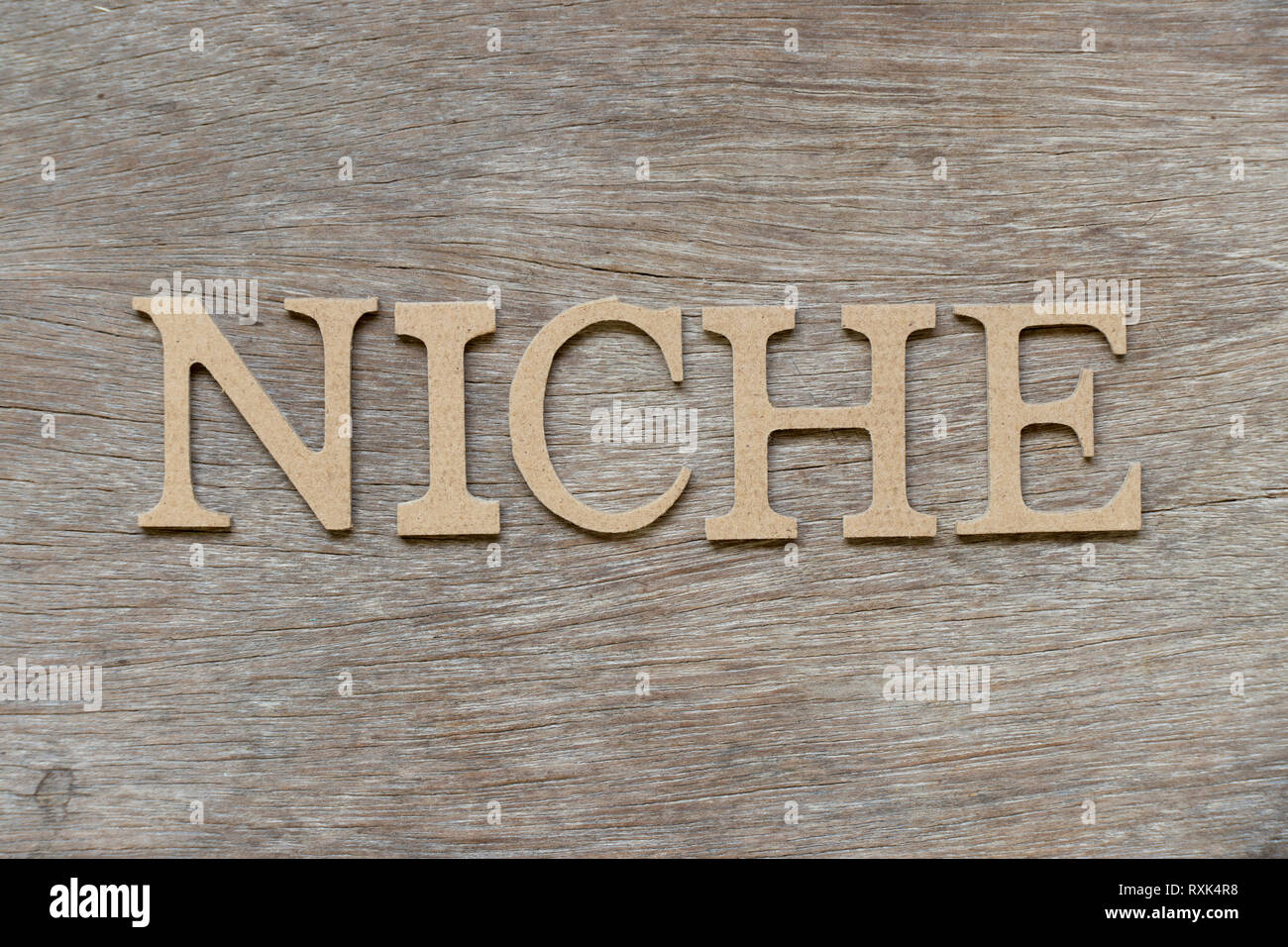 Alphabet letter in word niche on wood background Stock Photo - Alamy