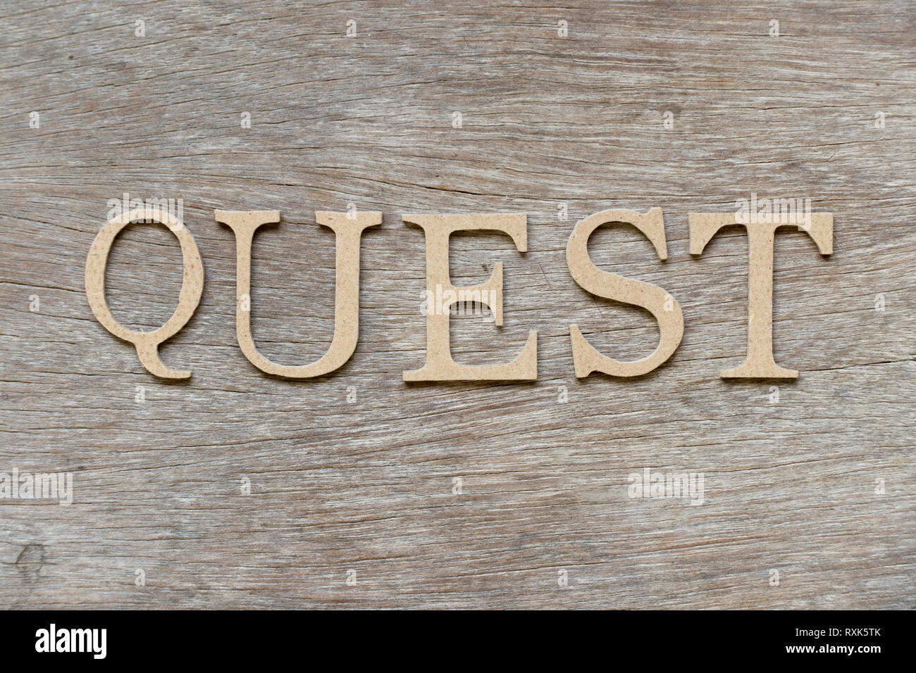Alphabet letter in word quest on wood background Stock Photo - Alamy