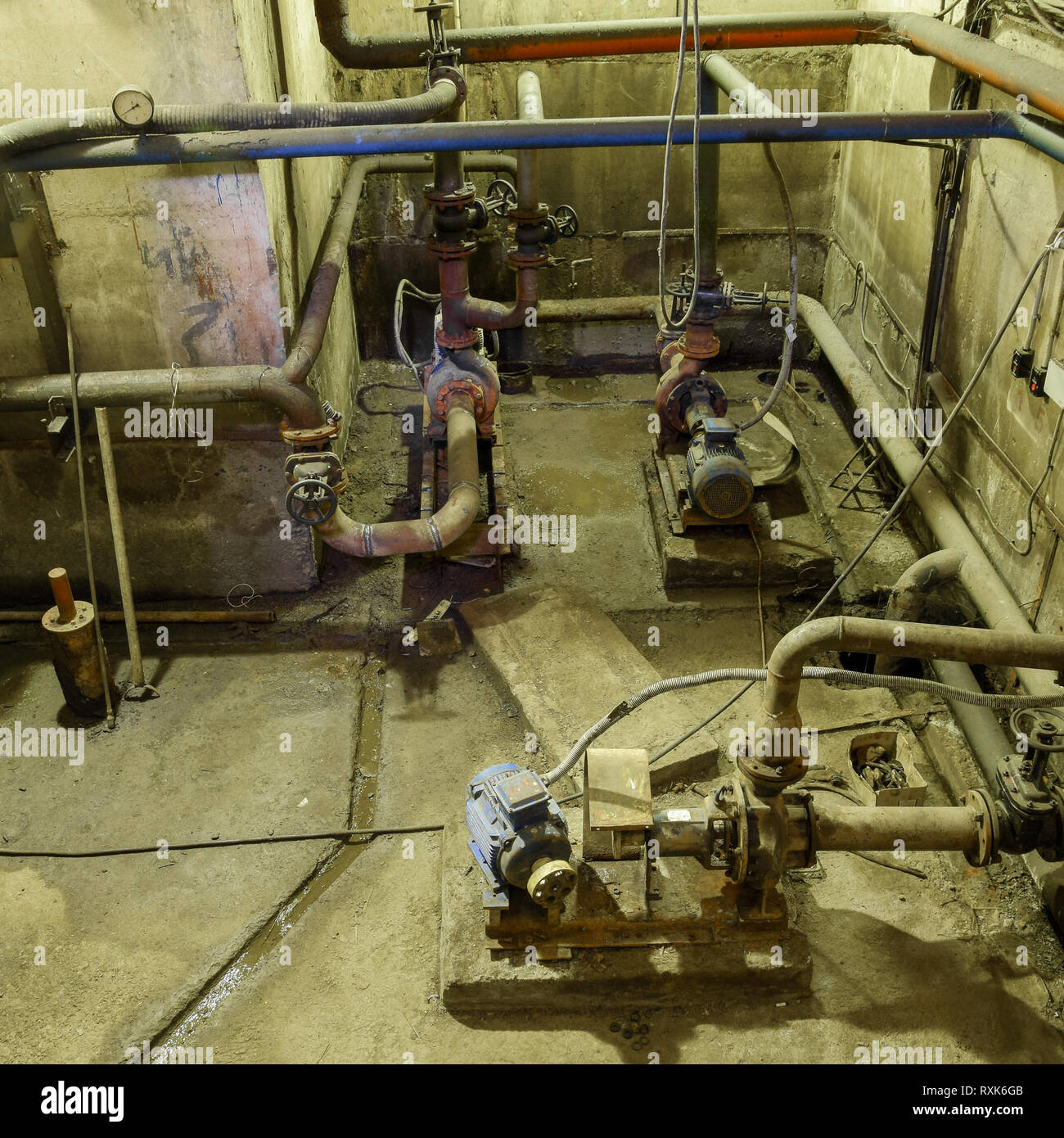 Basement of a water pumping station. Abandoned post-apocalyptic view of ...