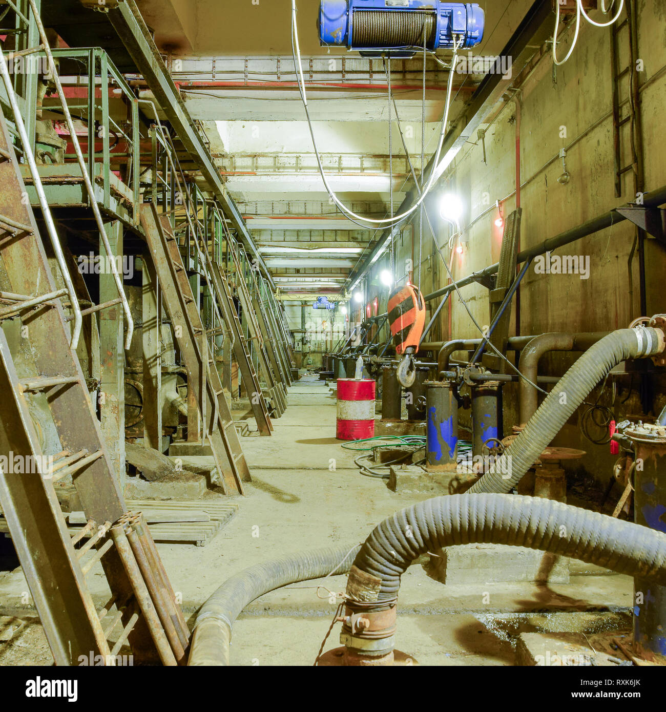 Basement of a water pumping station. Abandoned post-apocalyptic view of ...