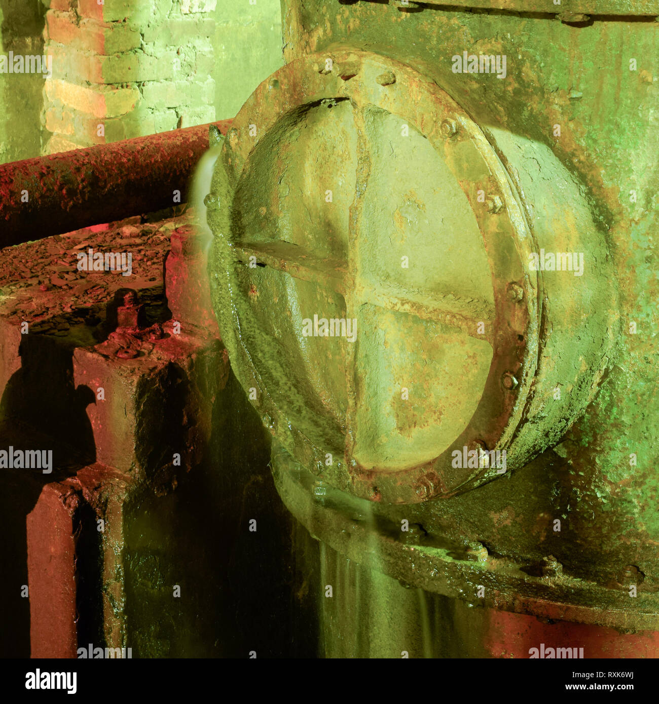 Basement of a water pumping station. Abandoned post-apocalyptic view of ...