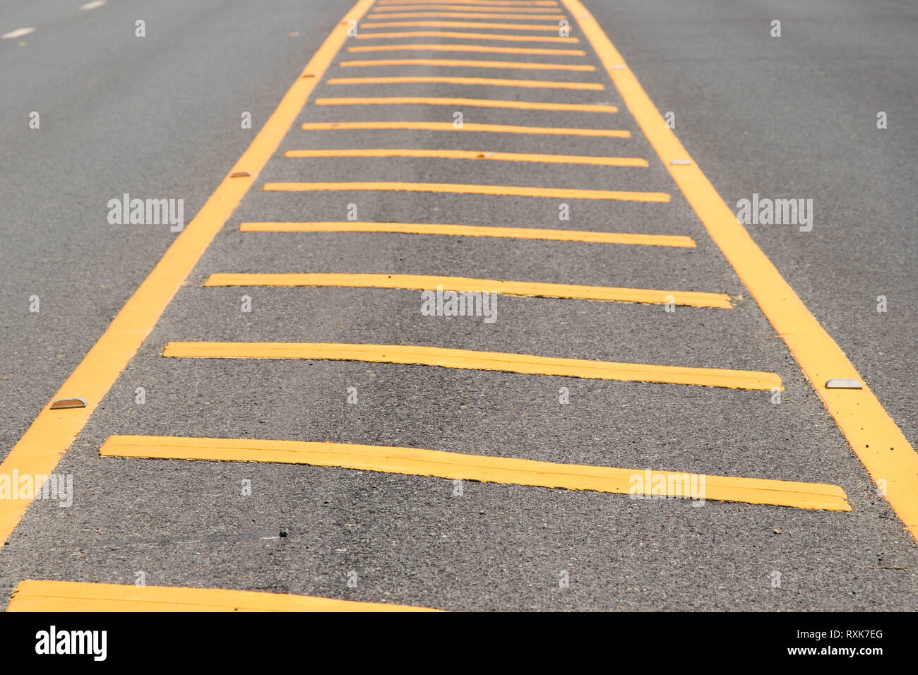 Yellow color road line on asphalt background Stock Photo - Alamy