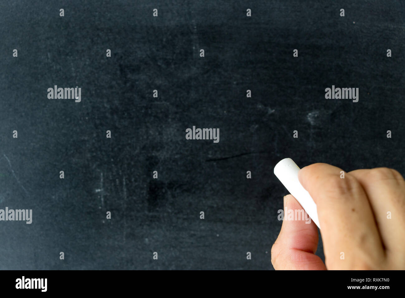Hand hold white chalk to write on blank blackboard background Stock ...