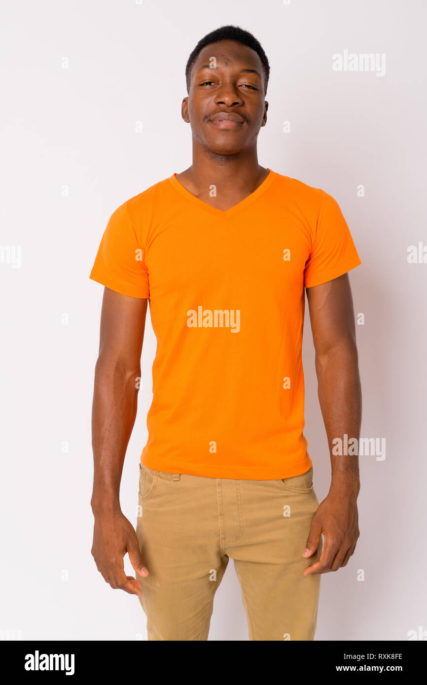Portrait of young handsome African man standing Stock Photo - Alamy