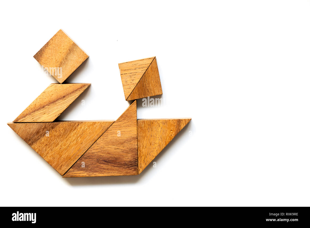 Wood tangram puzzle in boat with couple or friend shape on white ...