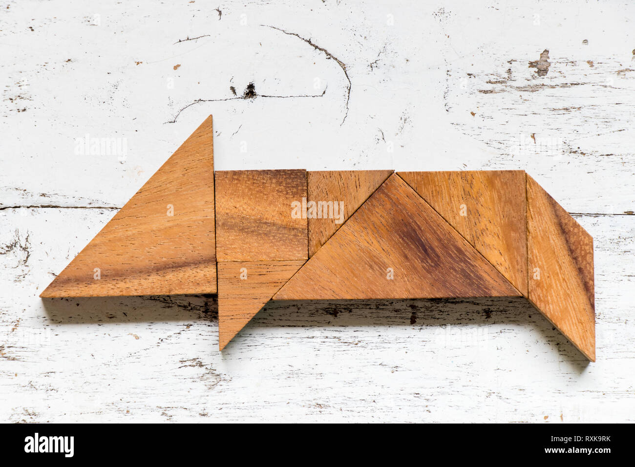 Tangram puzzle in pig shape on old white wood background Stock Photo ...