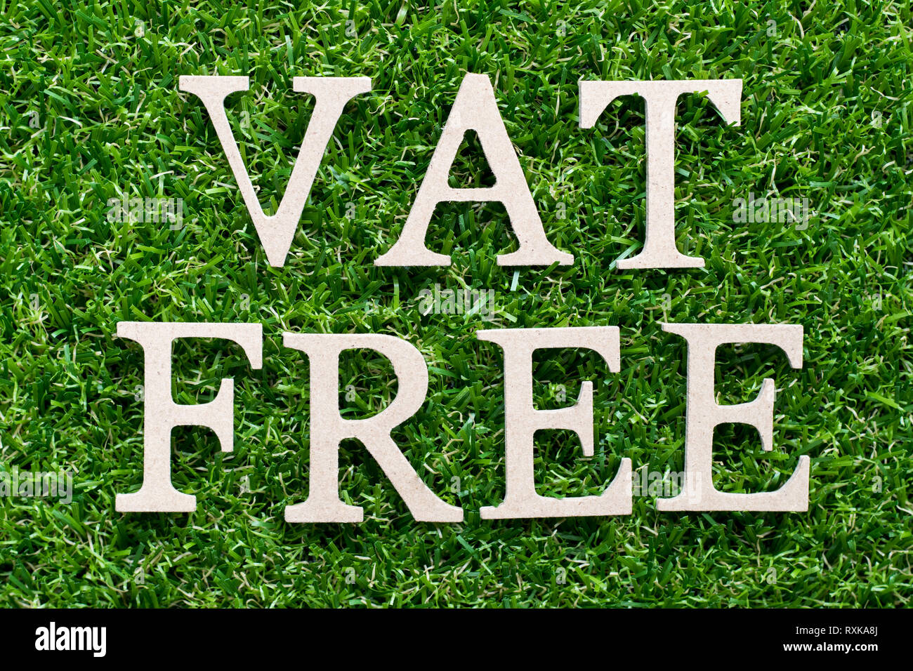 Wood alphabet in word VAT (abbreviation of value added tax) on ...