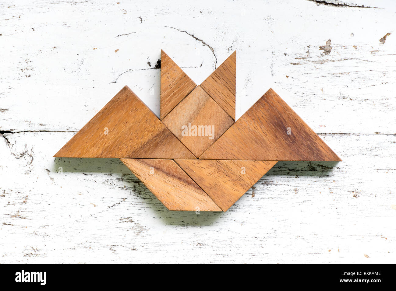 Tangram puzzle in bat shape on old white wood background Stock Photo ...