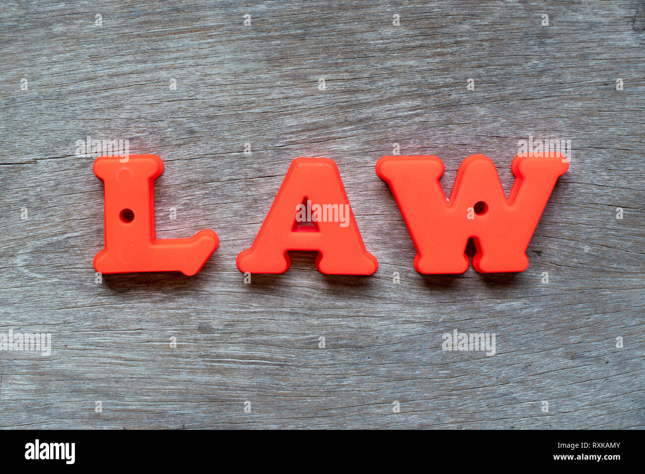Colorful plastic alphabet in word law on wood background Stock Photo ...