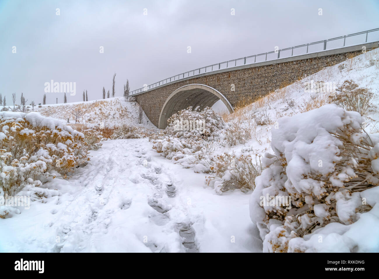 Trail and arched bridge at Daybreak Utah in winter Stock Photo - Alamy