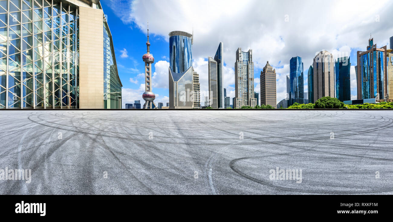 Empty asphalt square ground with panoramic city skyline in Shanghai ...