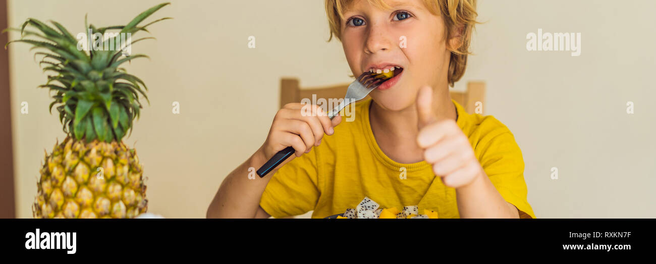 Boy eats fruit. Healthy food for children. Child eating healthy snack ...