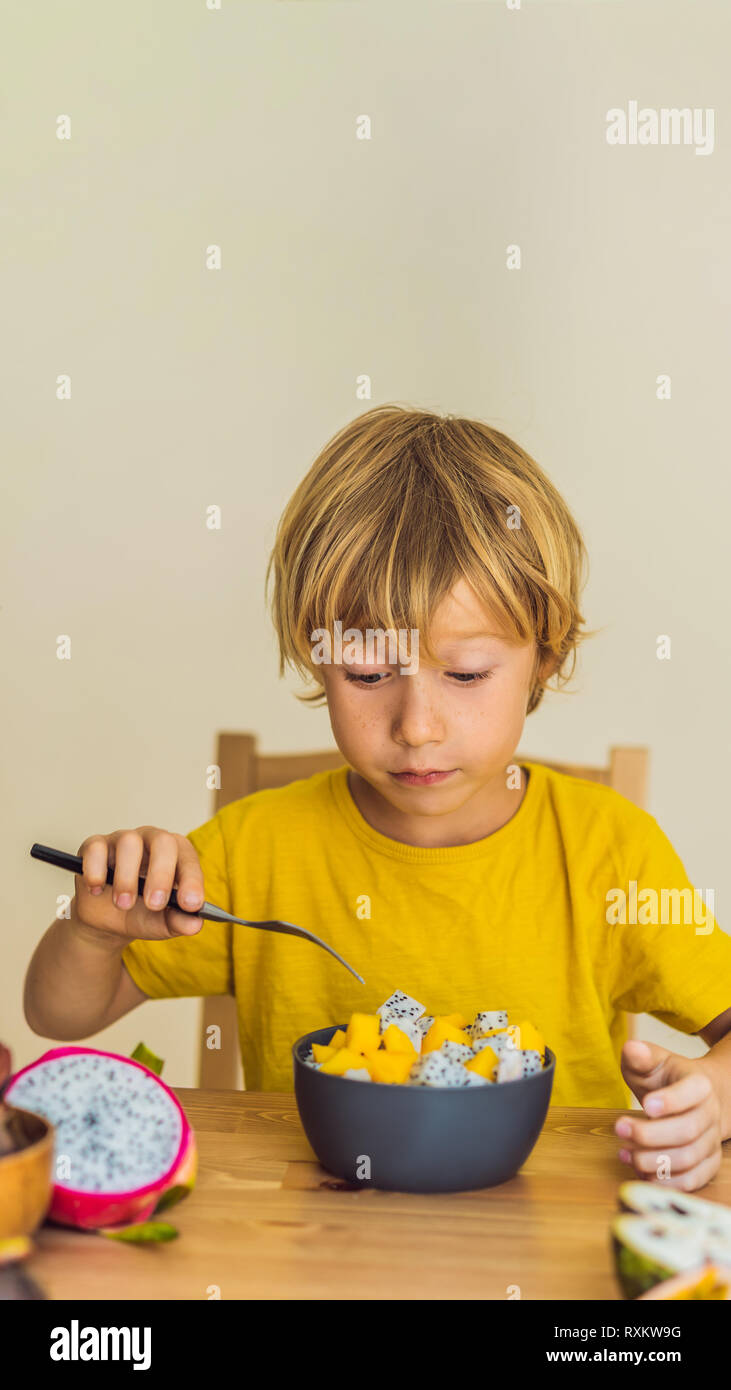 Boy eats fruit. Healthy food for children. Child eating healthy snack ...