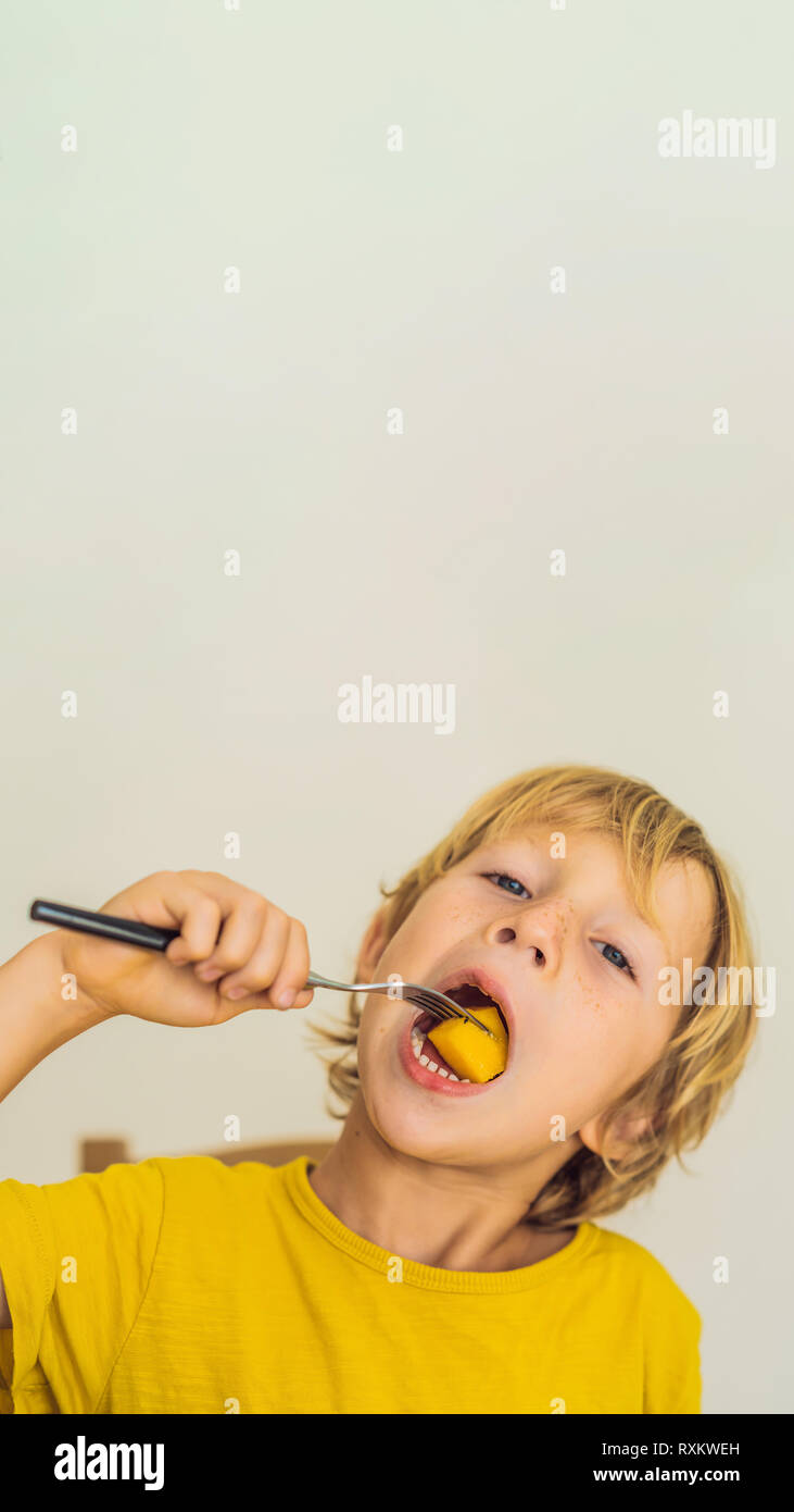 Boy eats fruit. Healthy food for children. Child eating healthy snack ...