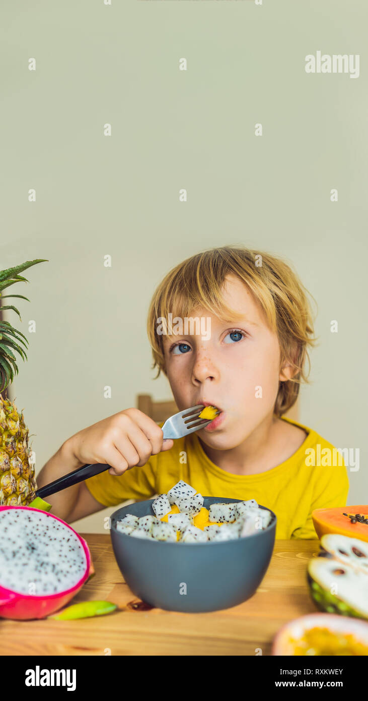 Boy eats fruit. Healthy food for children. Child eating healthy snack ...