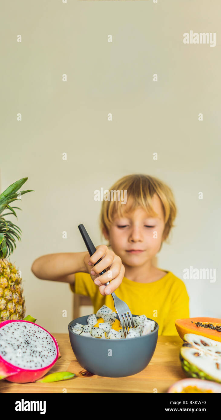 Boy eats fruit. Healthy food for children. Child eating healthy snack ...
