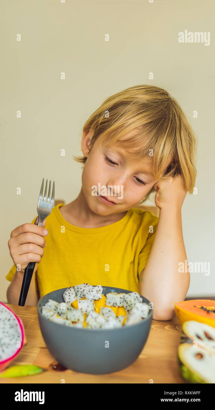 Boy eats fruit. Healthy food for children. Child eating healthy snack ...
