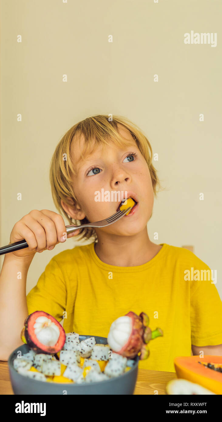 Boy eats fruit. Healthy food for children. Child eating healthy snack ...