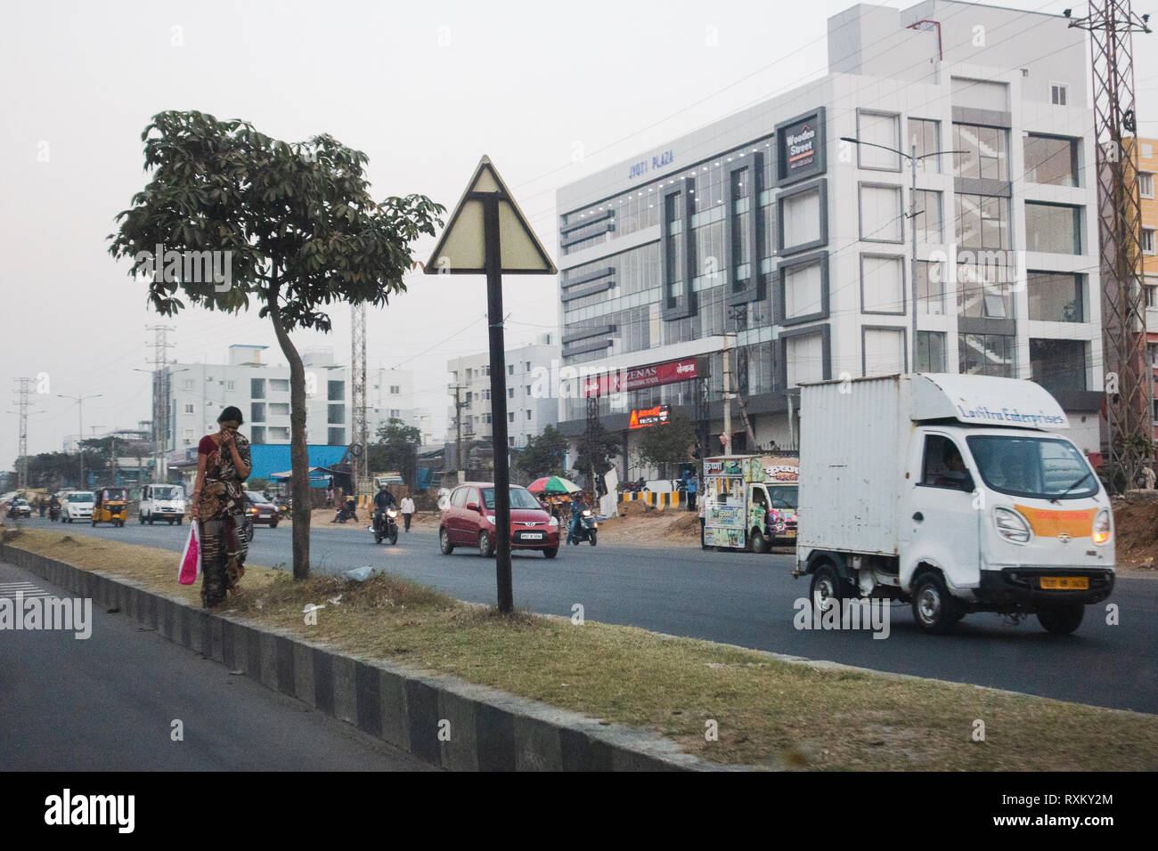 Indian woman crossing street hi-res stock photography and images - Alamy