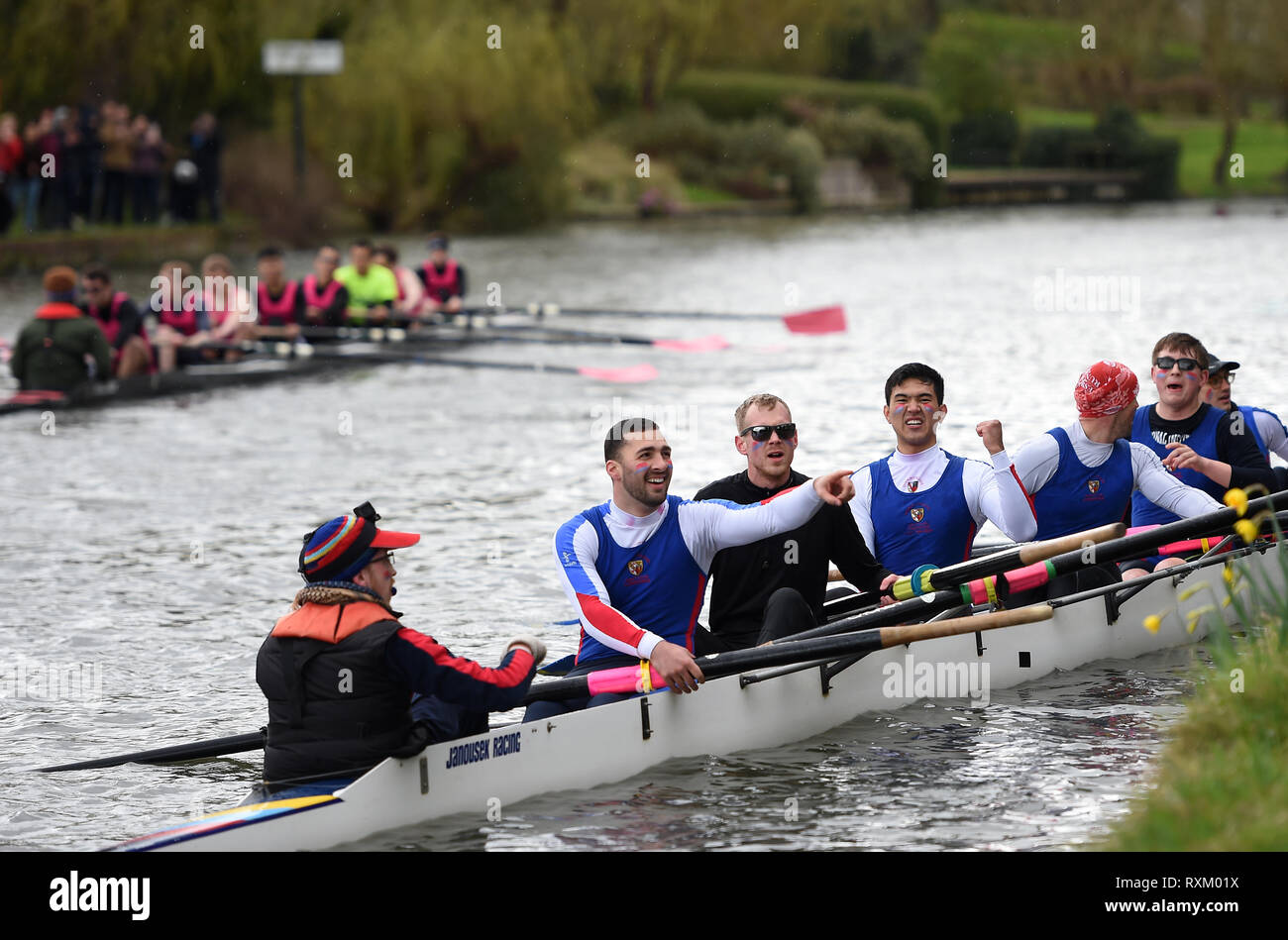 A crew from Darwin College celebrate a successful bump during the final ...