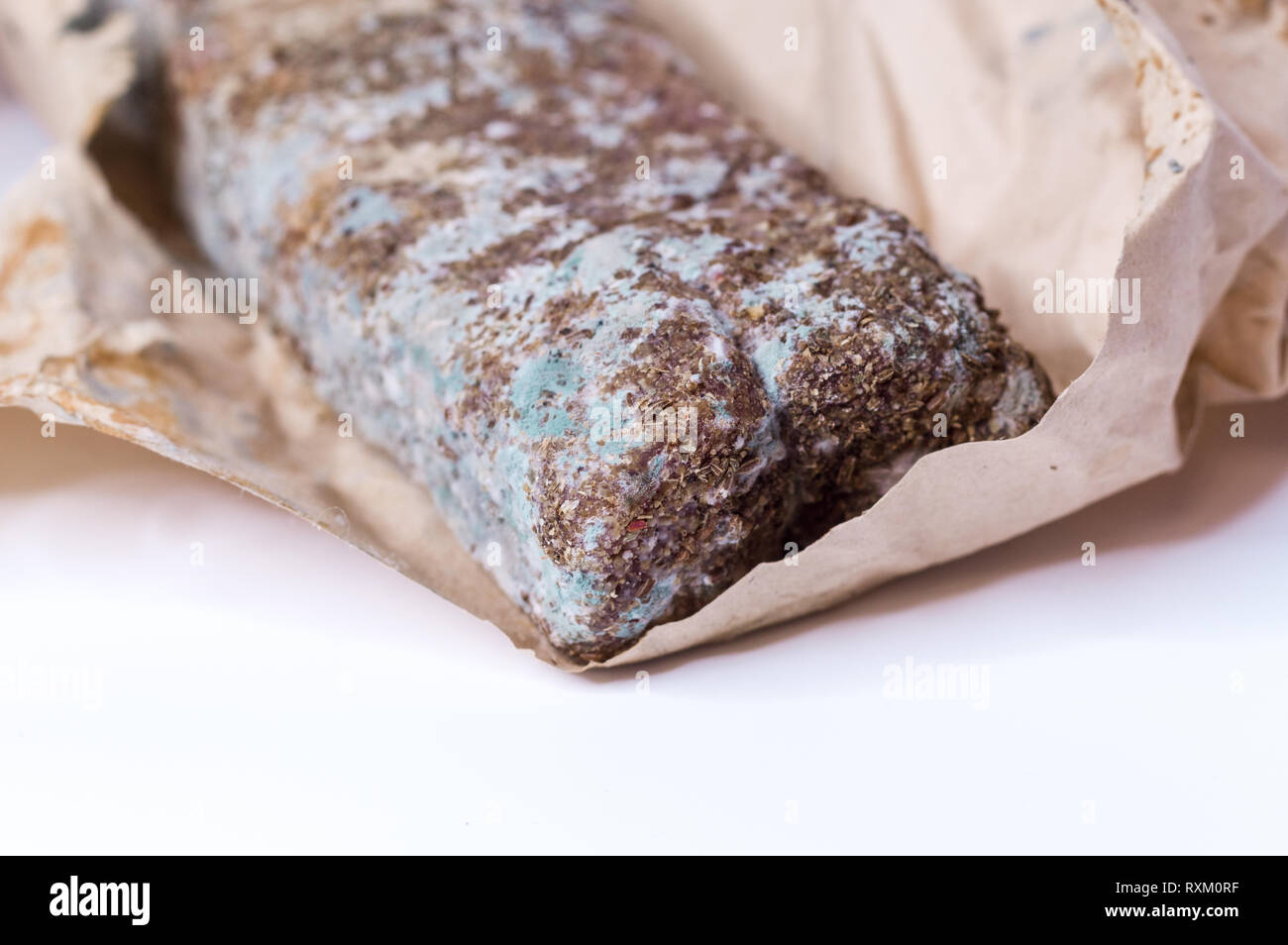 Moldy product in paper. Product with spices and mold. Front view Stock ...