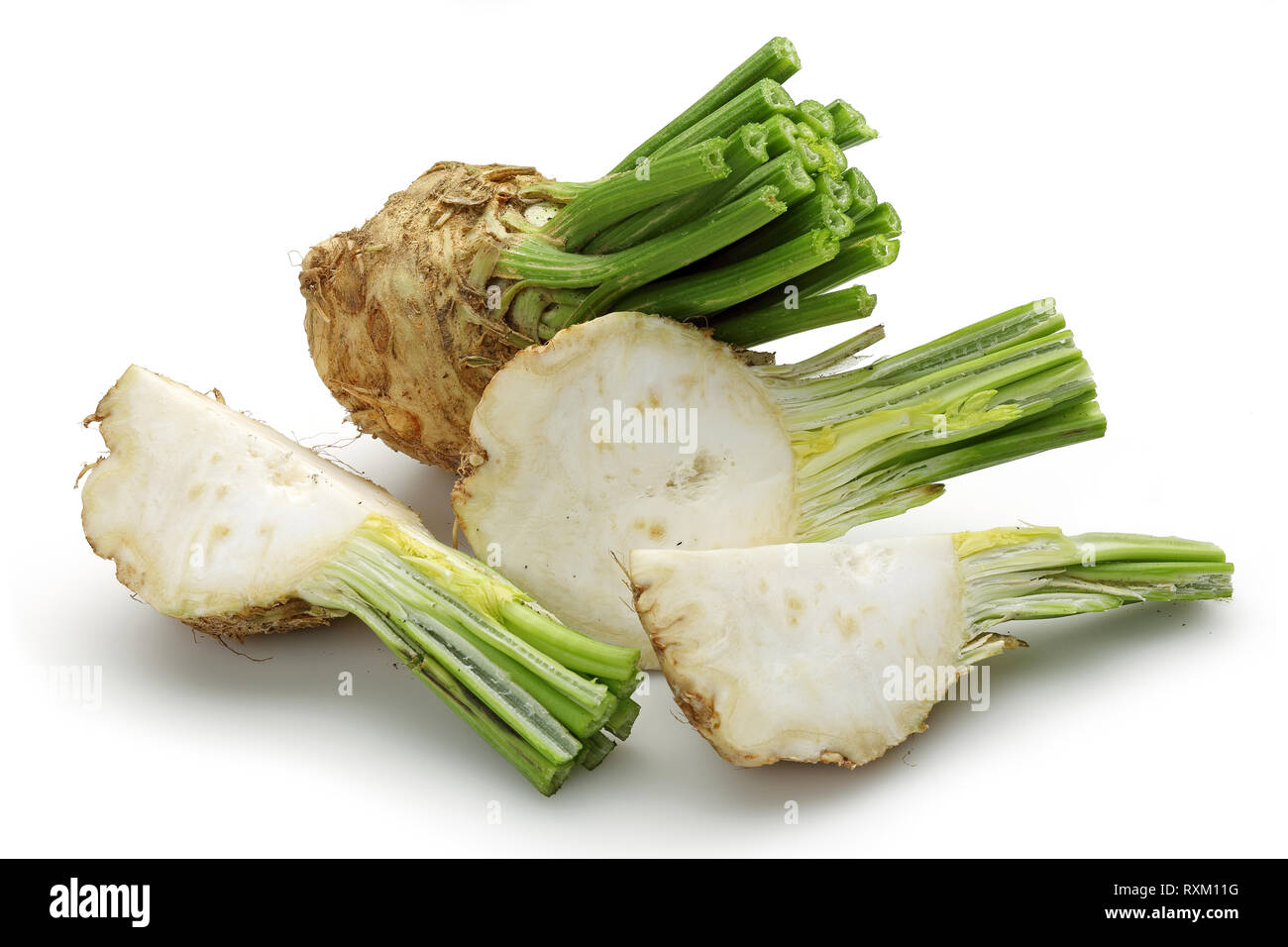 Fresh celeriac root with celery stalks and slice isolated on white ...