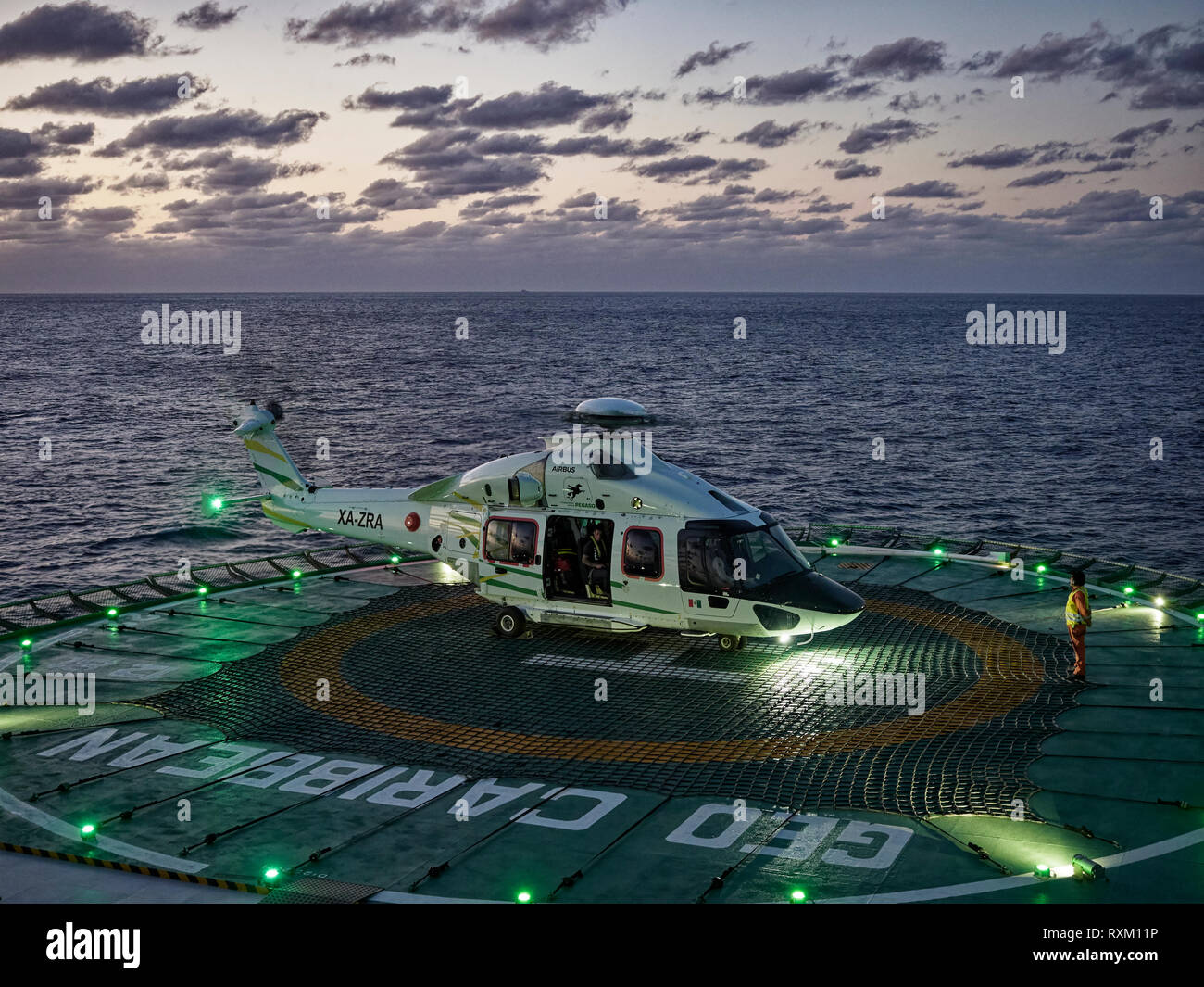 An Augusta 155 Medevac Helicopter on deck of a Ship for a Night Landing ...