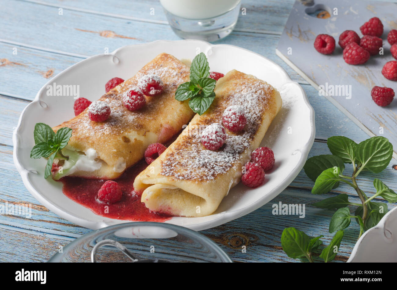 Delisious dessert with fresh fruit, mint and cheese filling inside ...